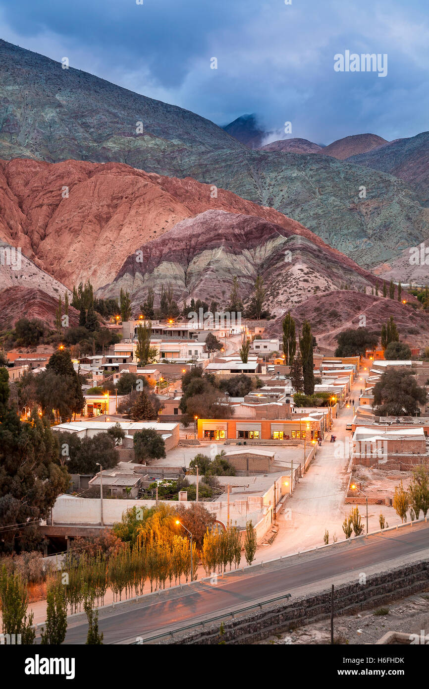 Nighttime cityscape of Purmamarca, town at the feet of the mountain ...