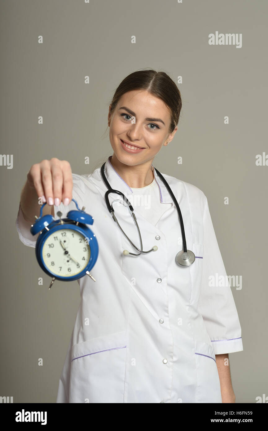 doctor with clock Stock Photo - Alamy