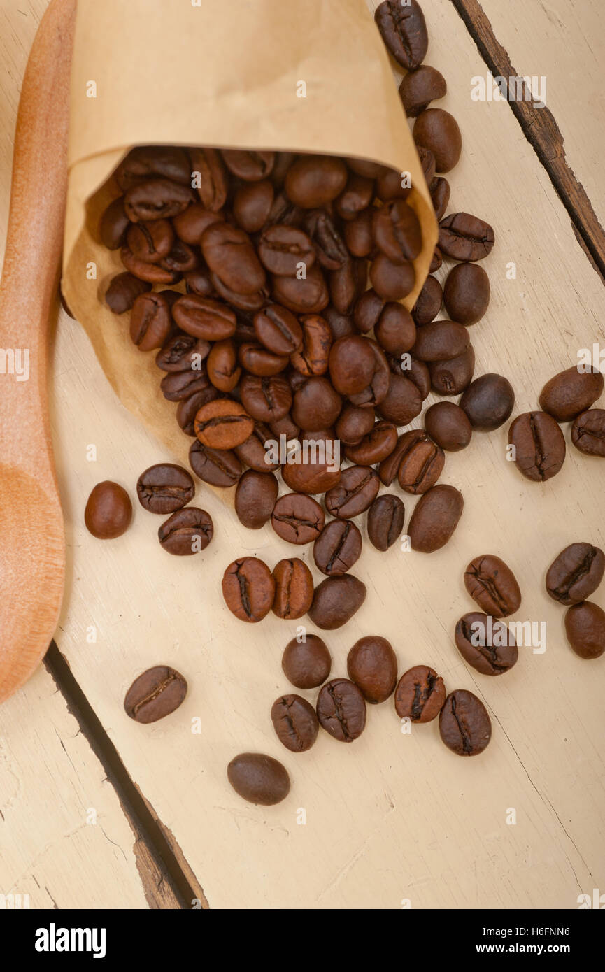 espresso coffee and beans on a paper cone cornucopia over white ...