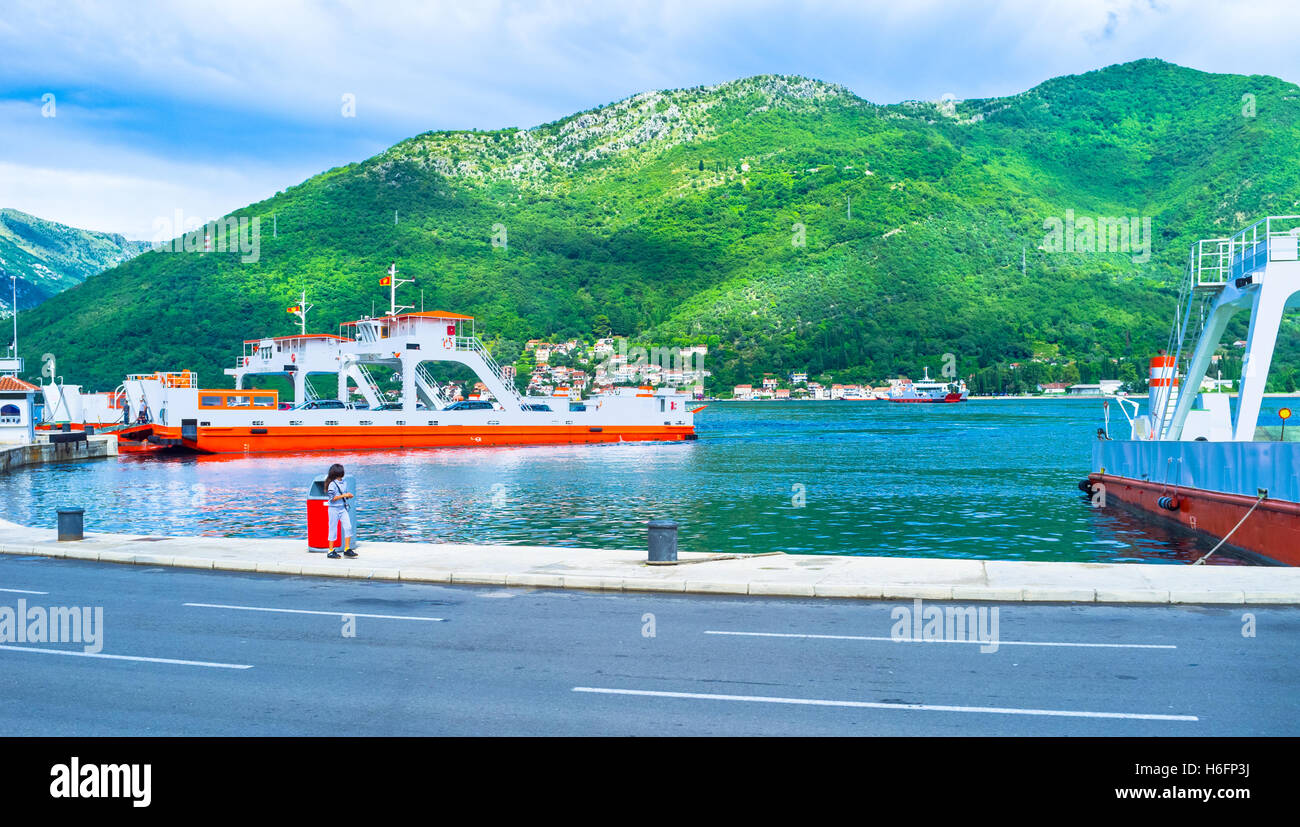 The bright ferries in Verige Strait with the green mountains on the ...