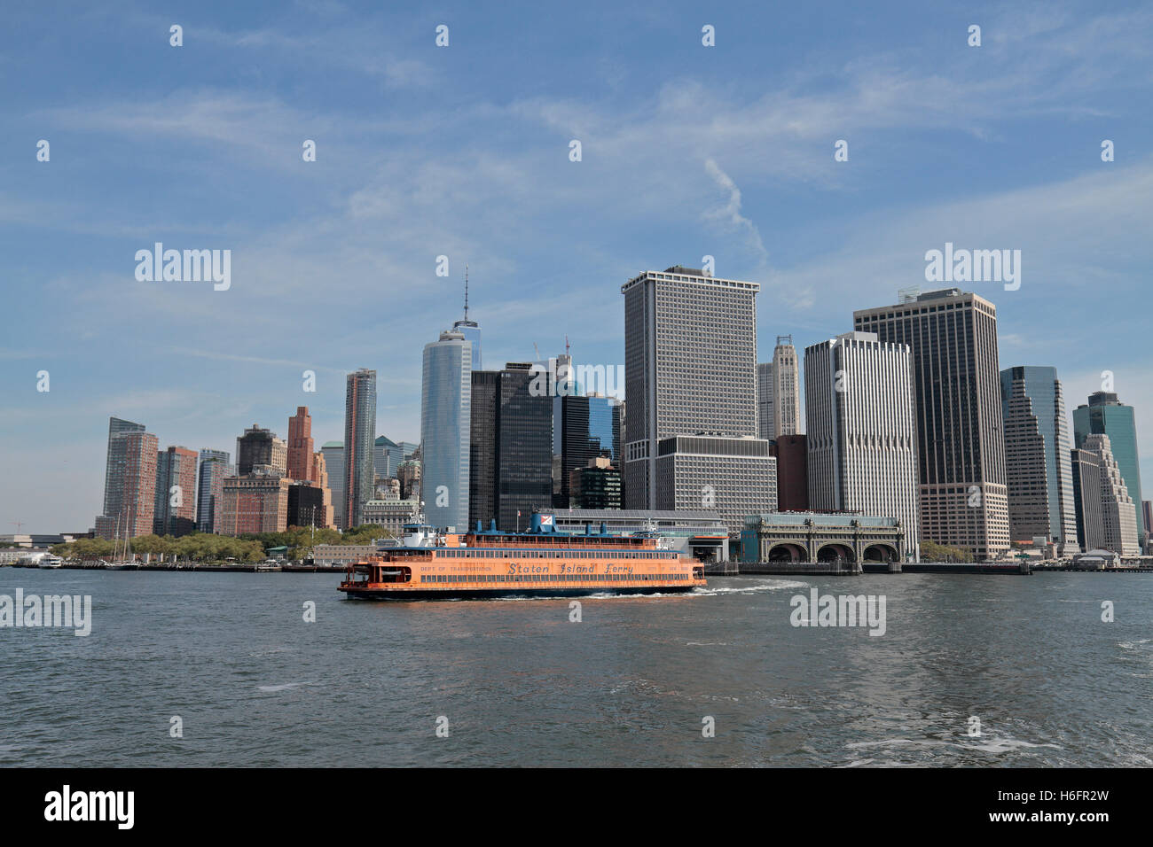 A Staten Island ferry departs the Manhattan terminal in front of the ...