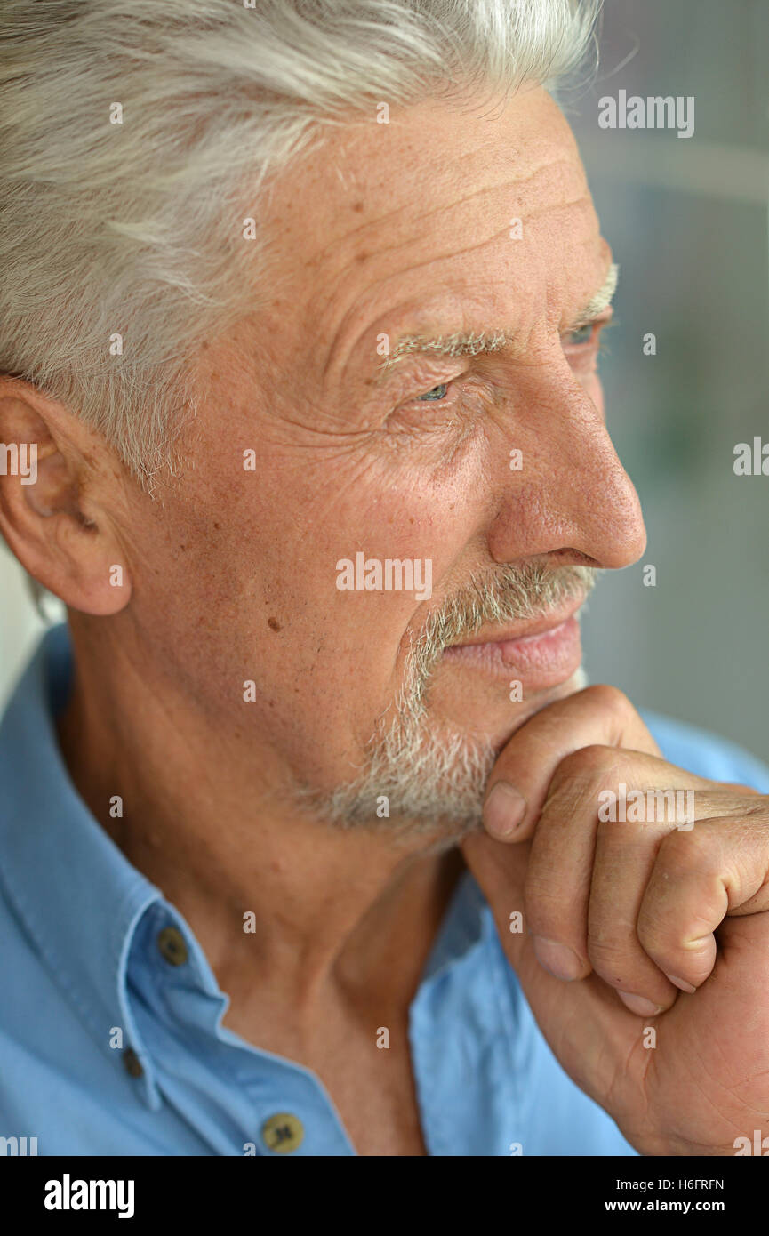 Sad senior man at home Stock Photo - Alamy