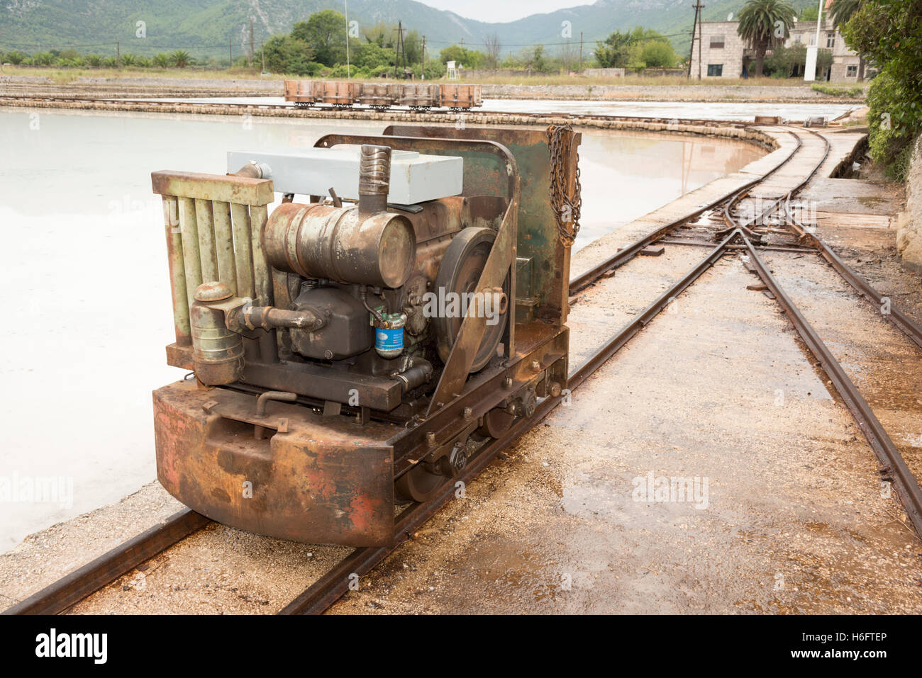 The railway line and a locomotive and tracks with wooden carts used to ...