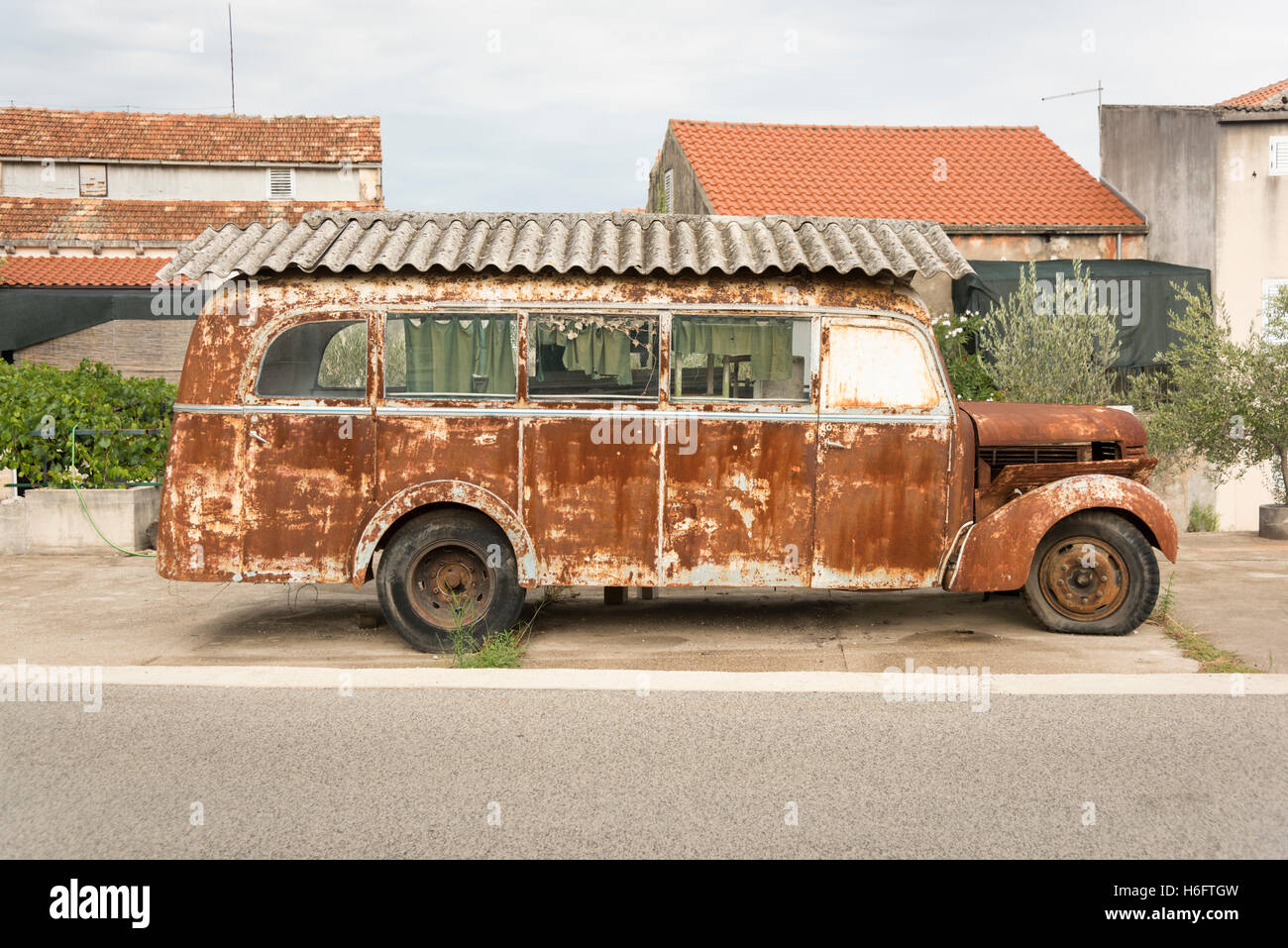 A rusty old vintage motorhome with an asbestos roof parked in Drace ...