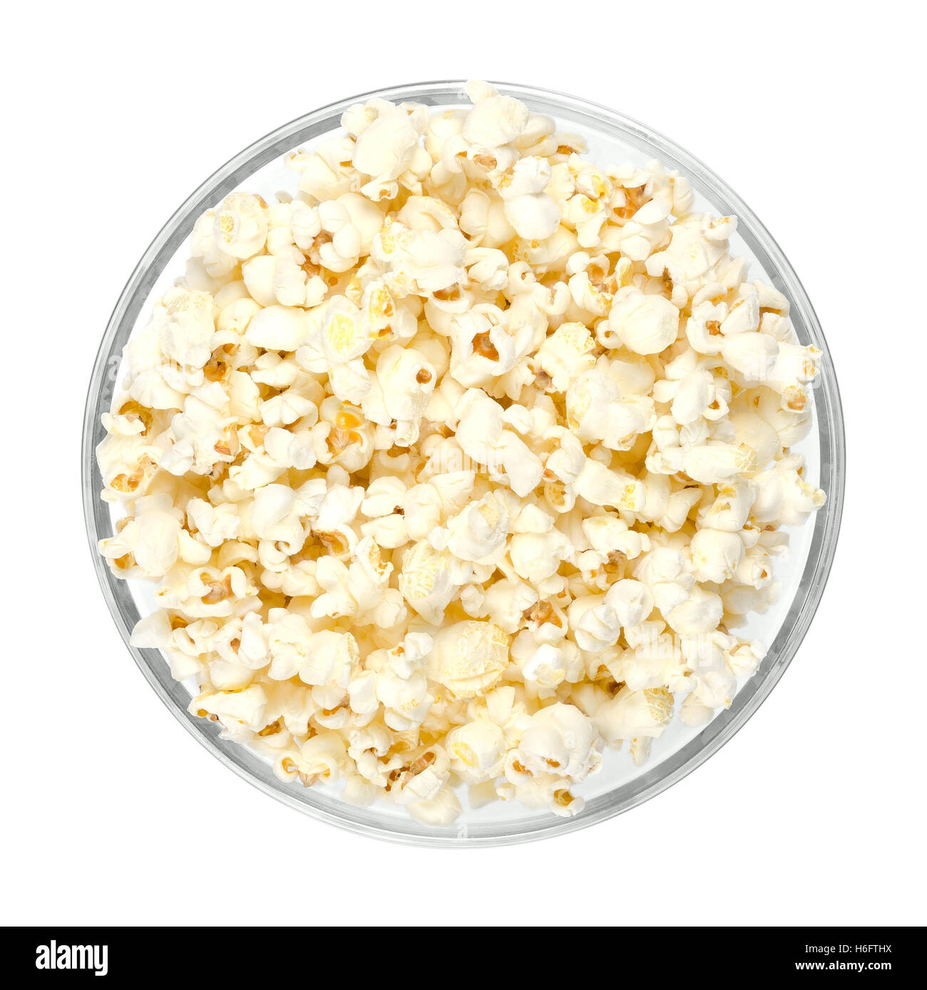 Popped popcorn in glass bowl on white background. Butterfly shaped ...