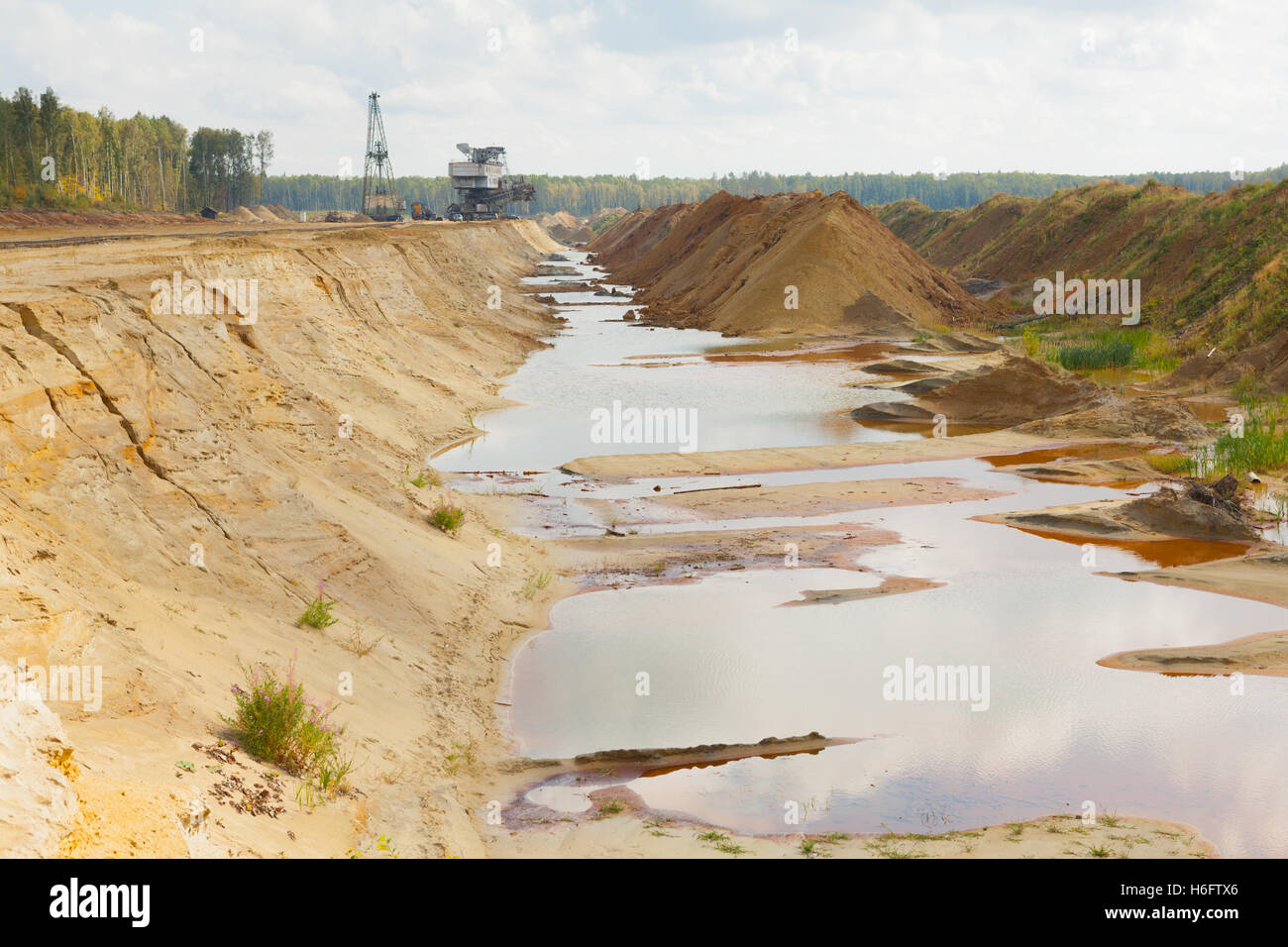 Ecological catastrophy in mud sand mining quarry Stock Photo - Alamy