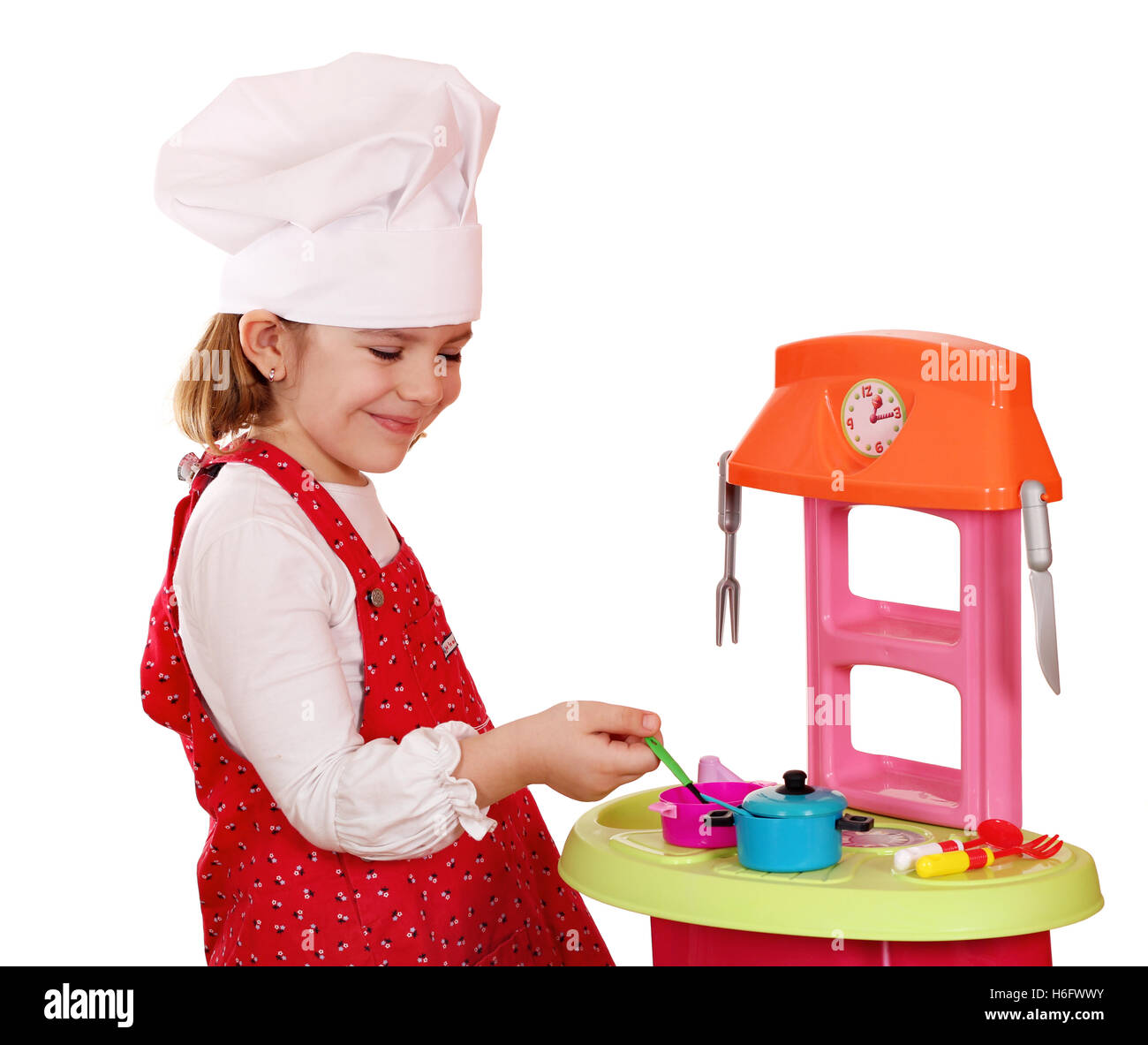 happy little girl play cooking Stock Photo - Alamy