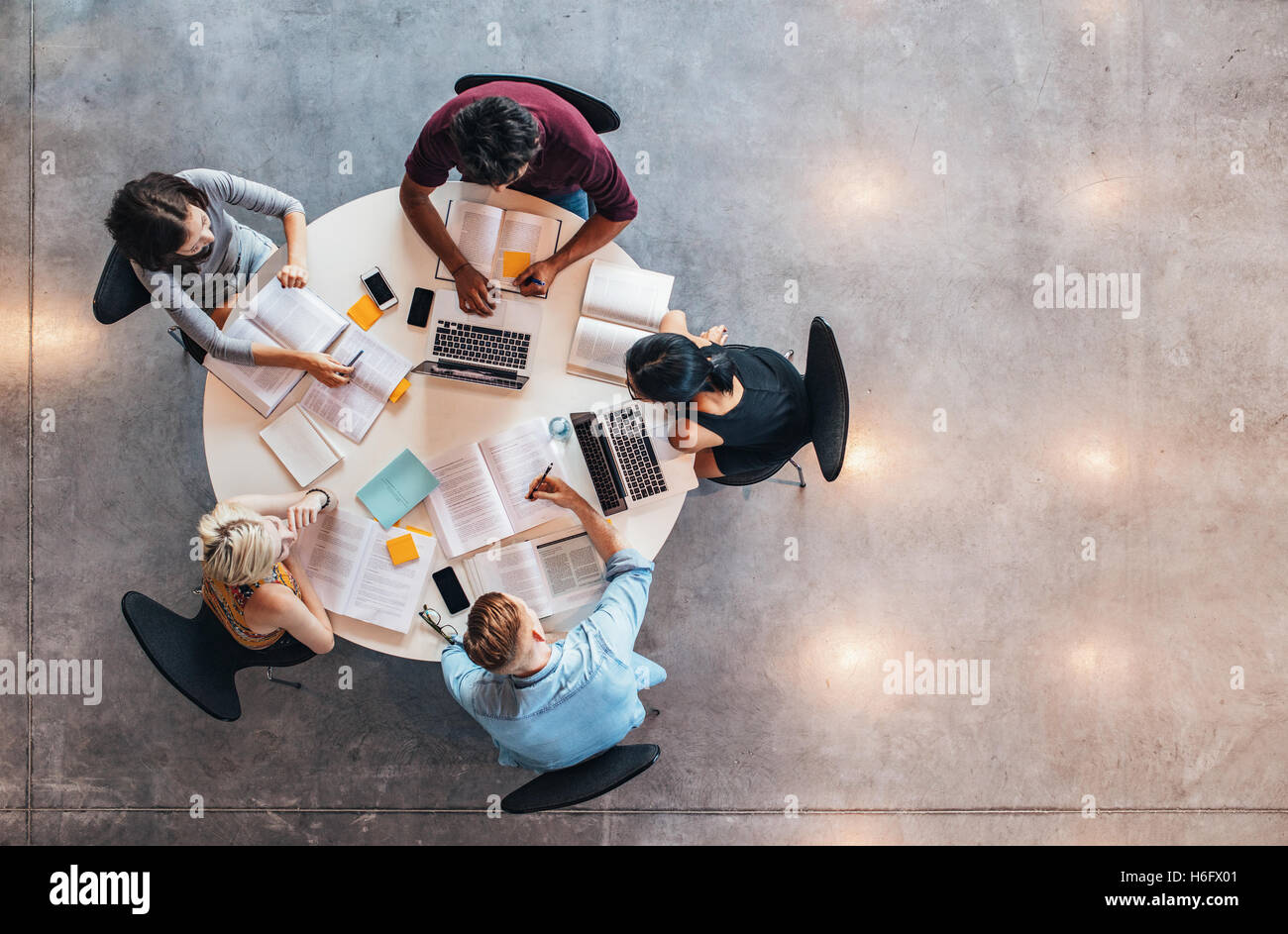 Top view of group of students sitting together at table. university ...