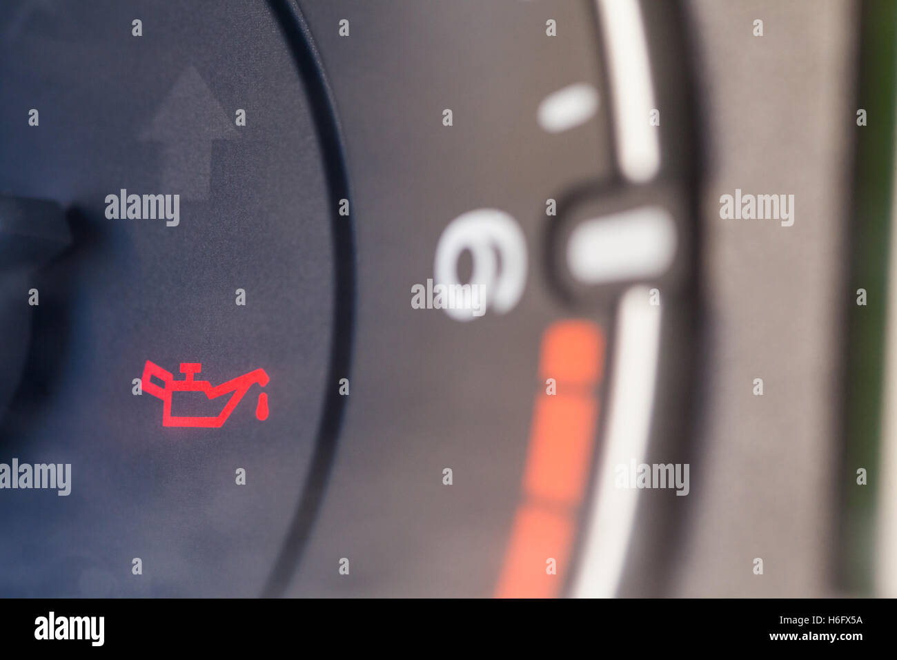 Detail of the dashboard of a car, with the oil alert icon lit up Stock ...