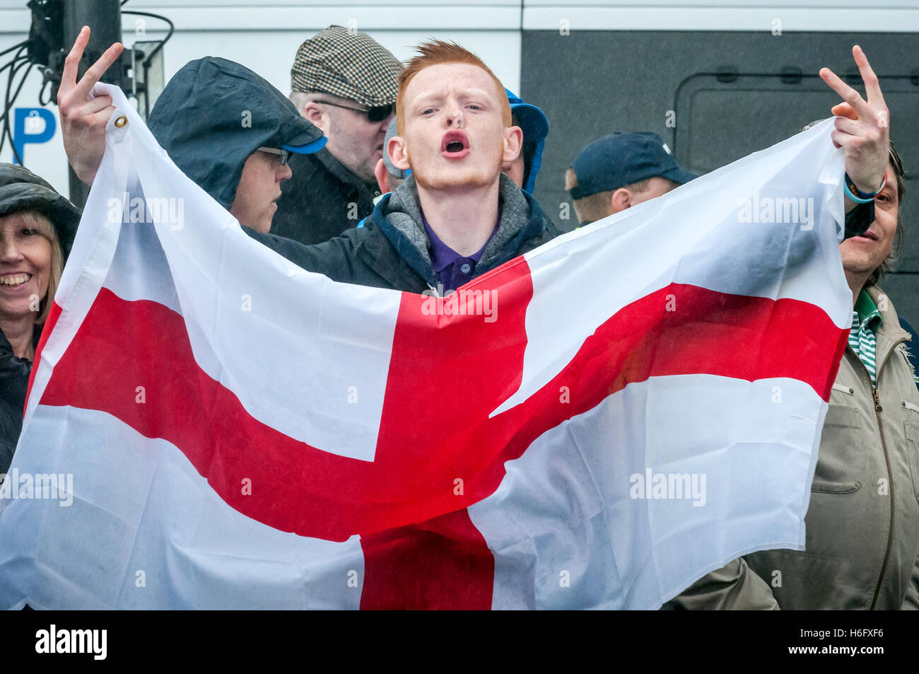 Members of the English Defence League march through Brighton, protected ...