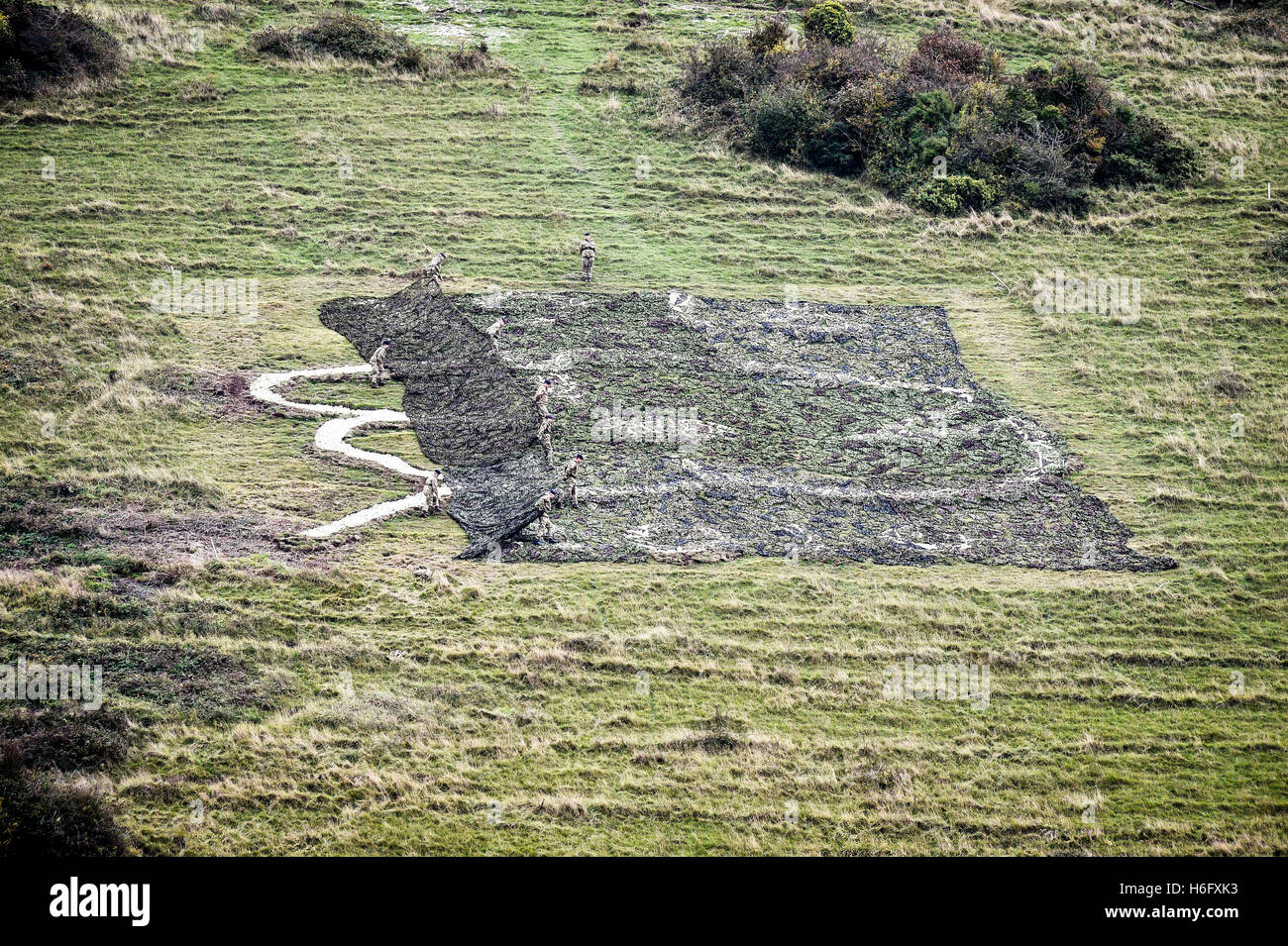 Soldiers from 243 The Wessex Field Hospital unveil a newly-carved ...