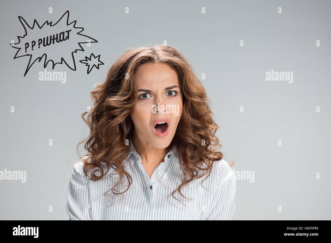 Portrait of young woman with shocked facial expression Stock Photo - Alamy