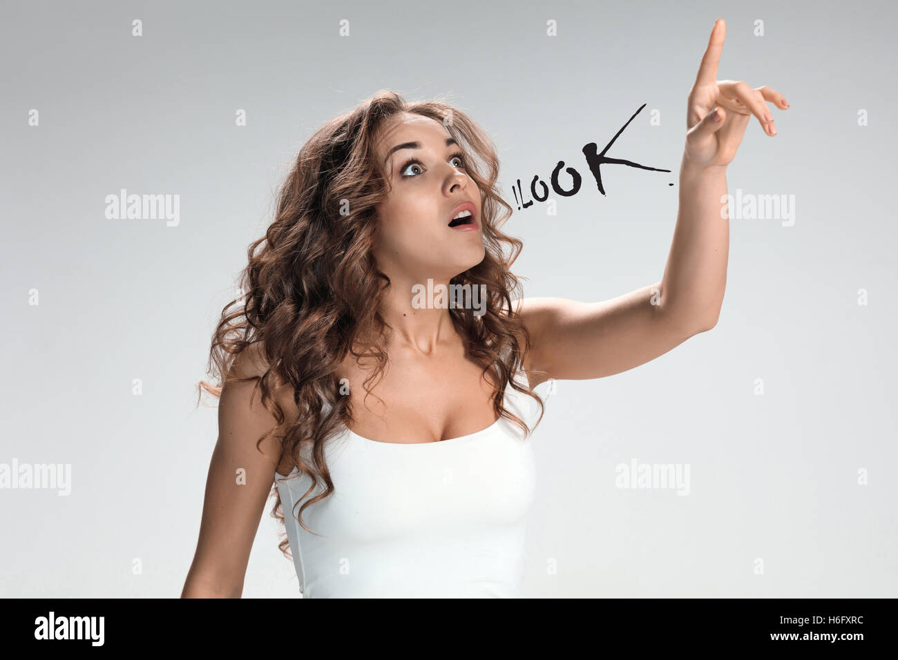 Portrait of young woman with shocked facial expression Stock Photo - Alamy