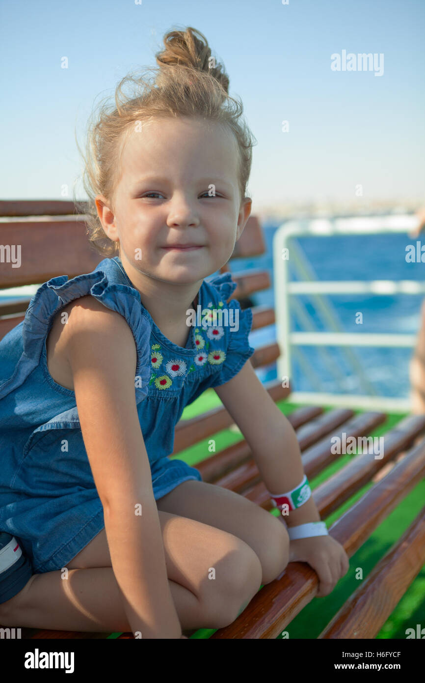 pretty little girl looking at you Stock Photo - Alamy