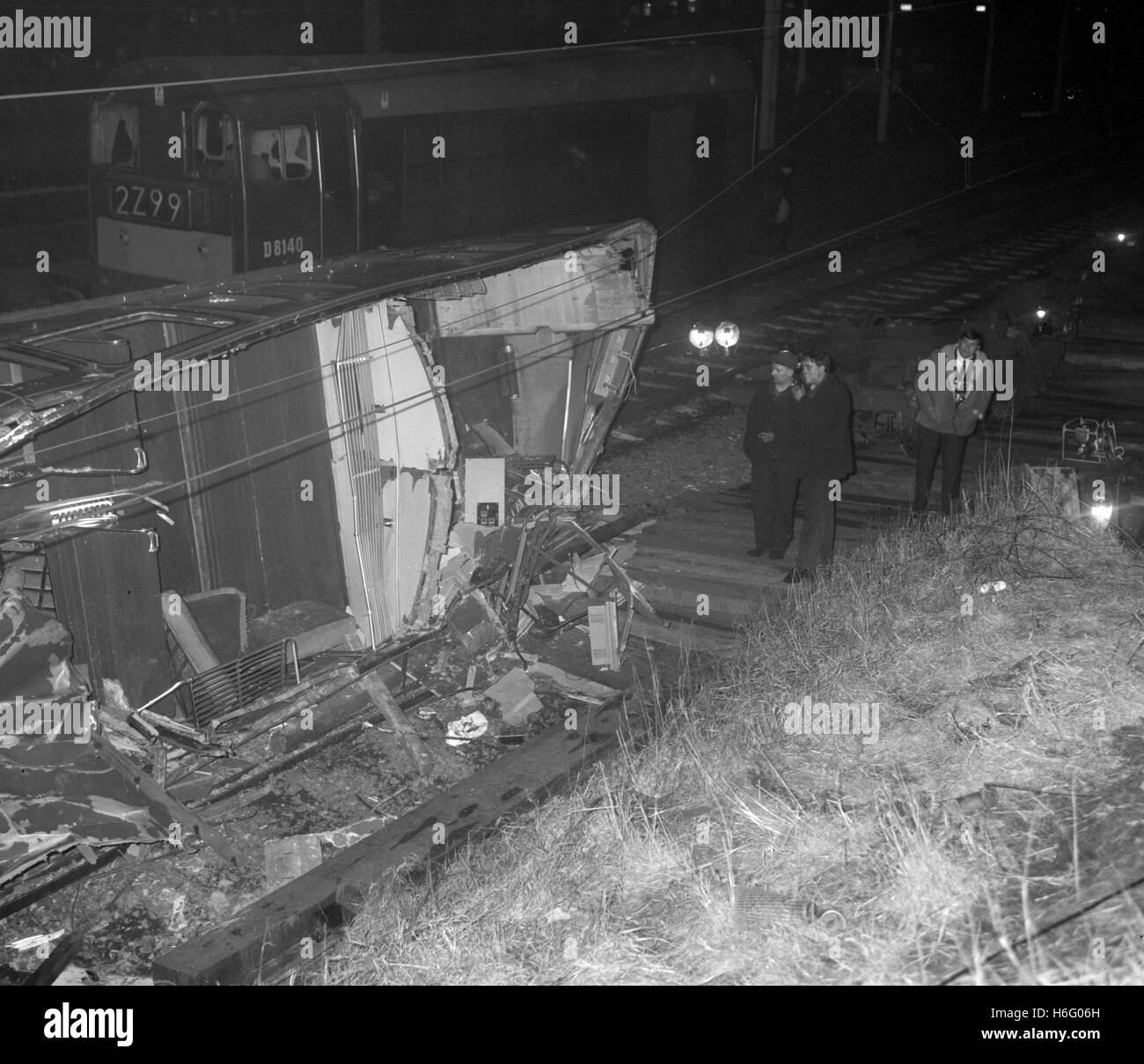 The wrecked roof of one of the coaches of the four-car passenger train ...