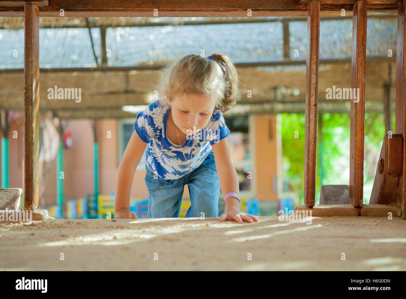 The beautiful girl playing to a sandbox Stock Photo - Alamy