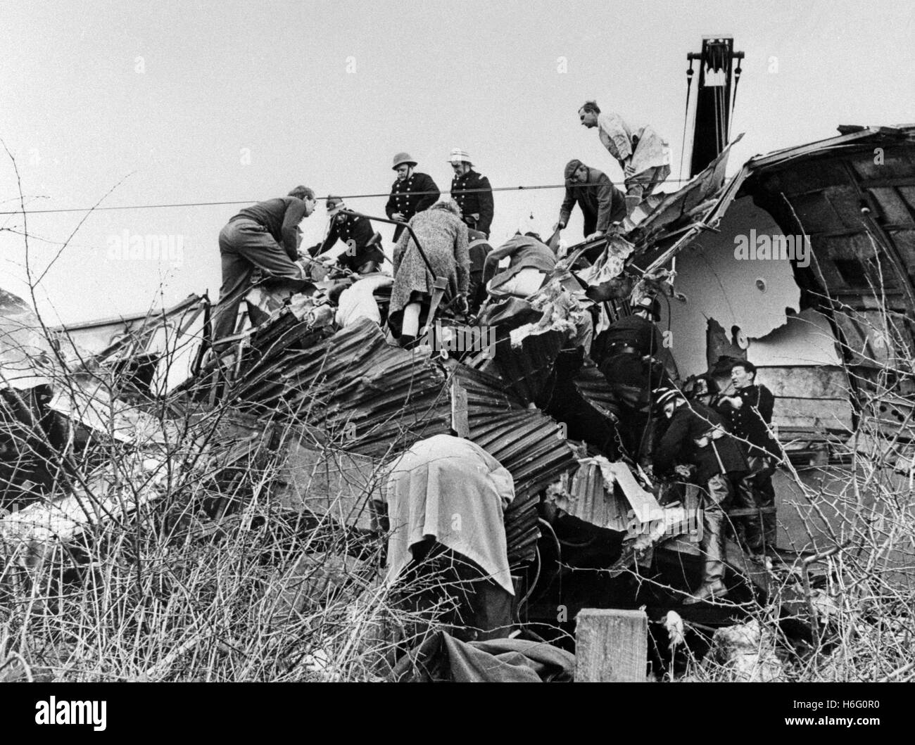 Rescue workers helping casualties from a rail crash after a low-loader ...