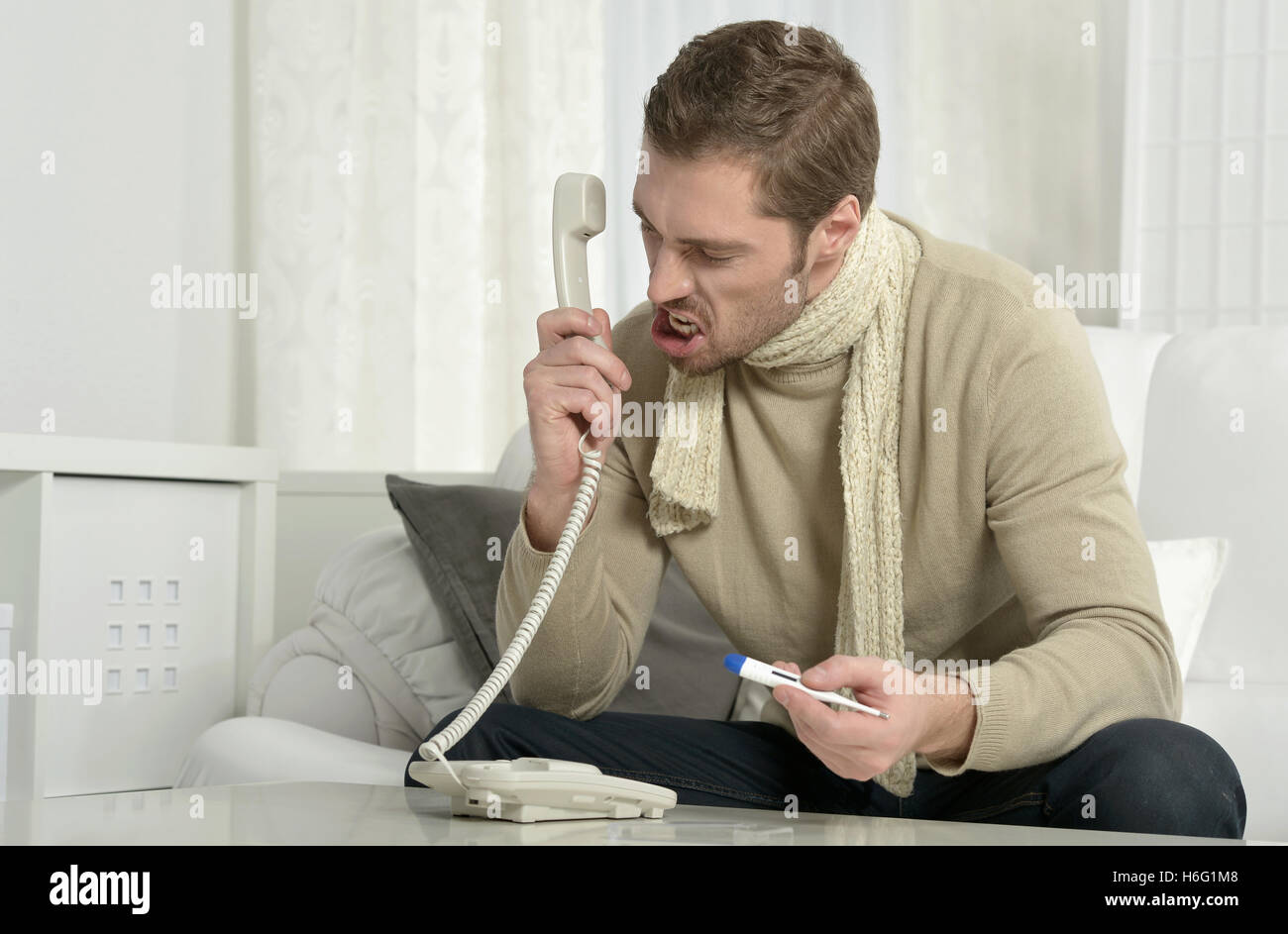 sick man calling his doctor Stock Photo - Alamy