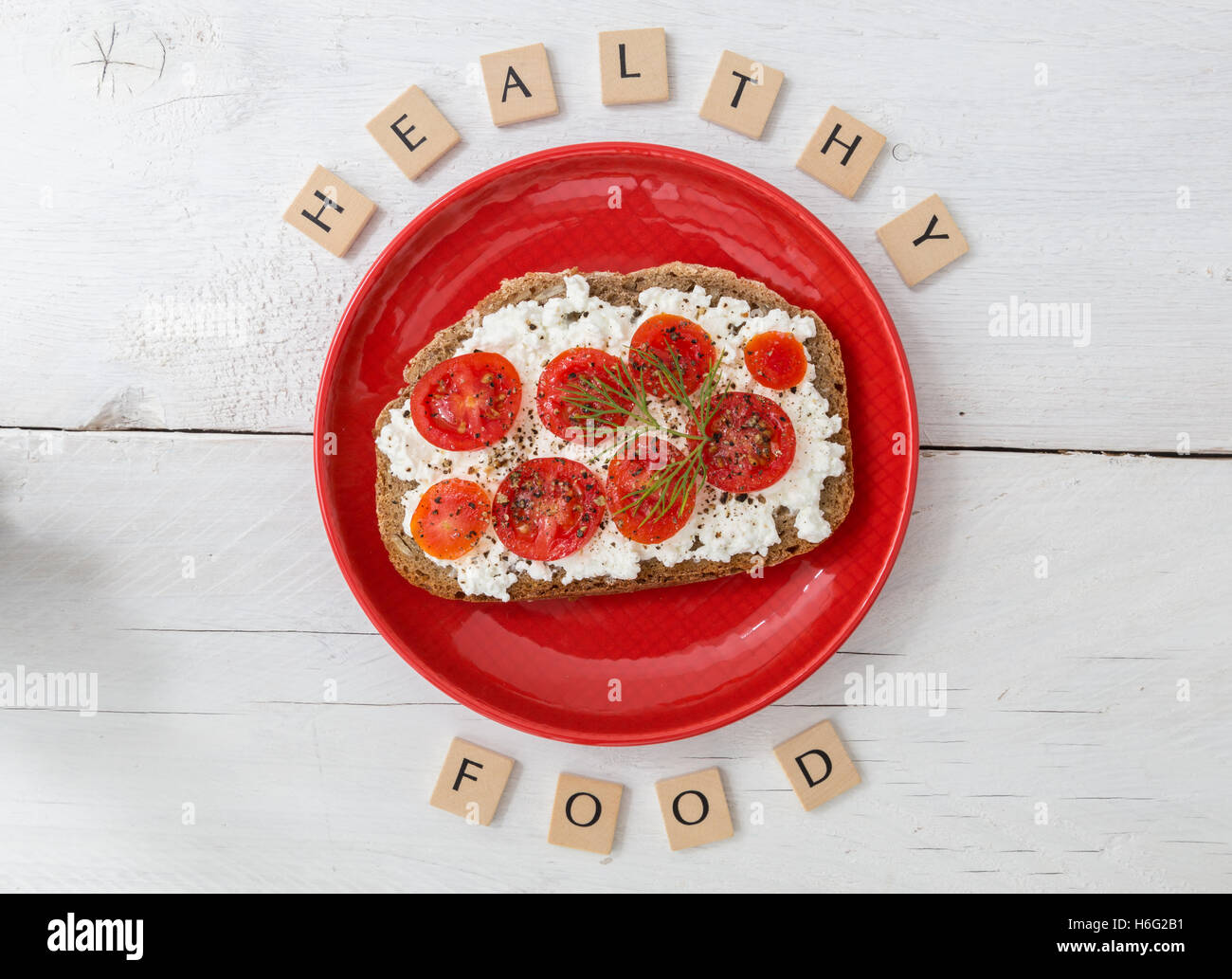 Healthy food letters with tomato bread Stock Photo - Alamy