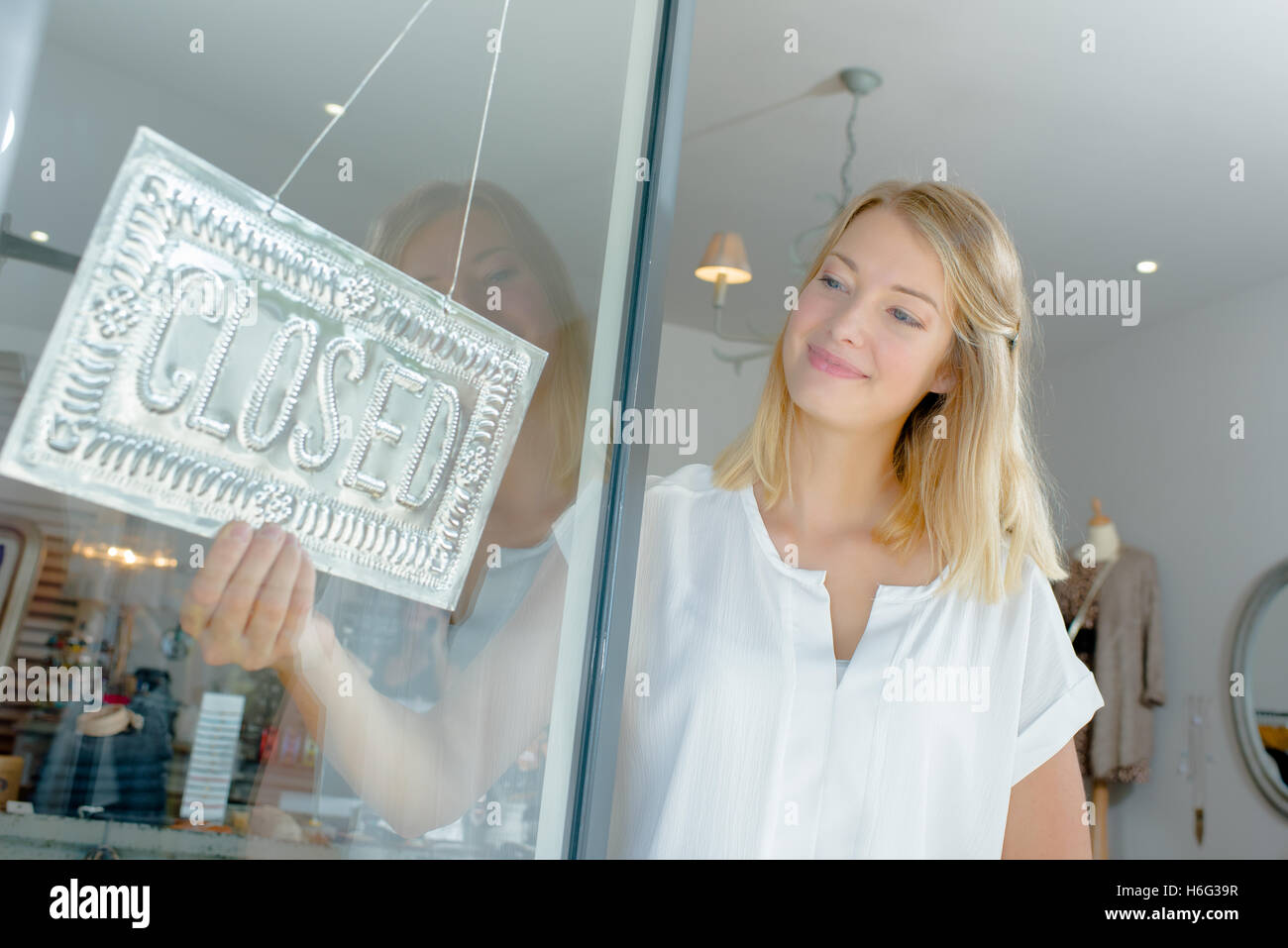 girl closing a shop Stock Photo - Alamy