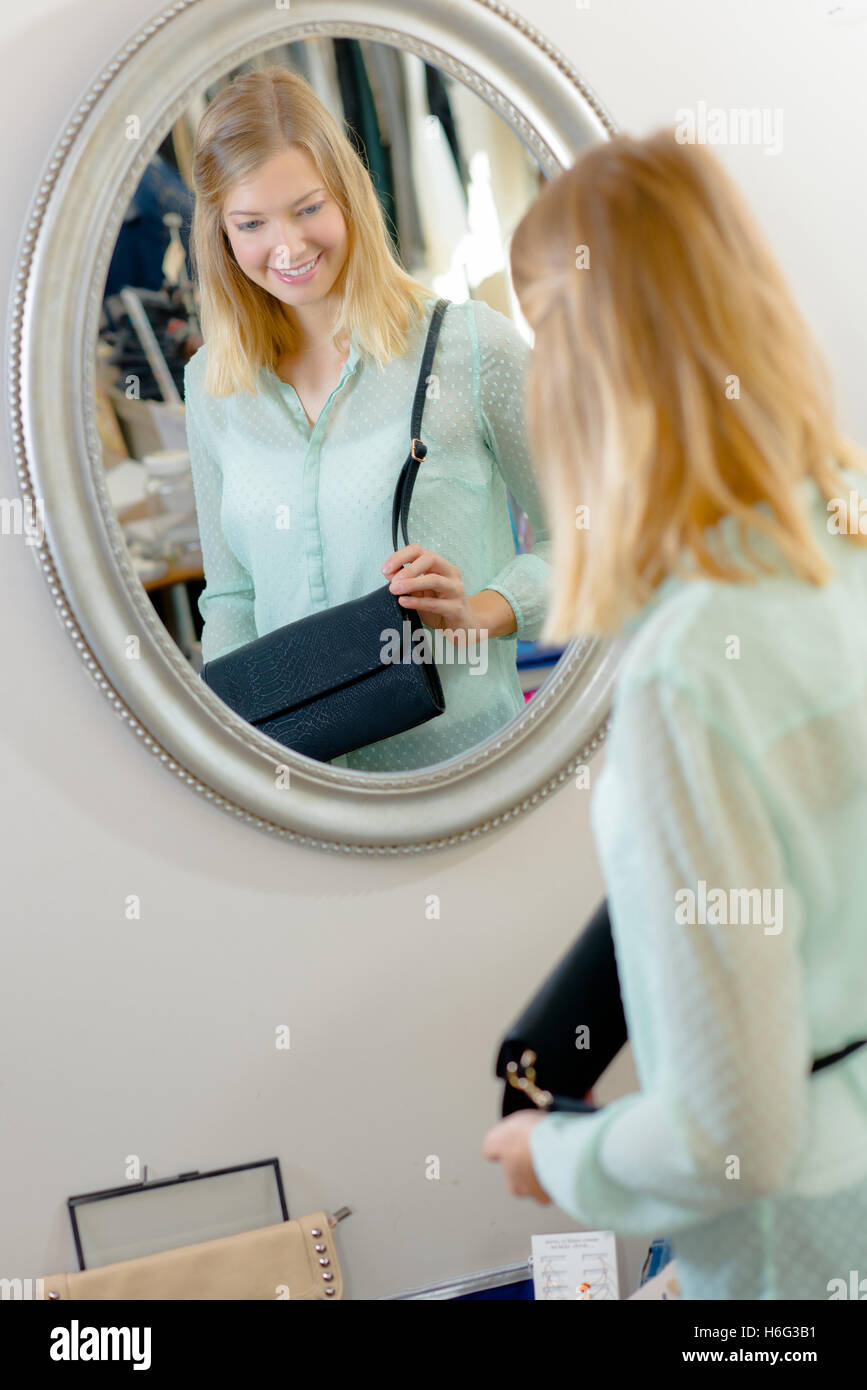 woman looking in mirror Stock Photo - Alamy
