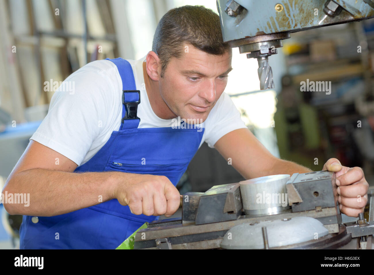 Worker using bench drill hi-res stock photography and images - Alamy