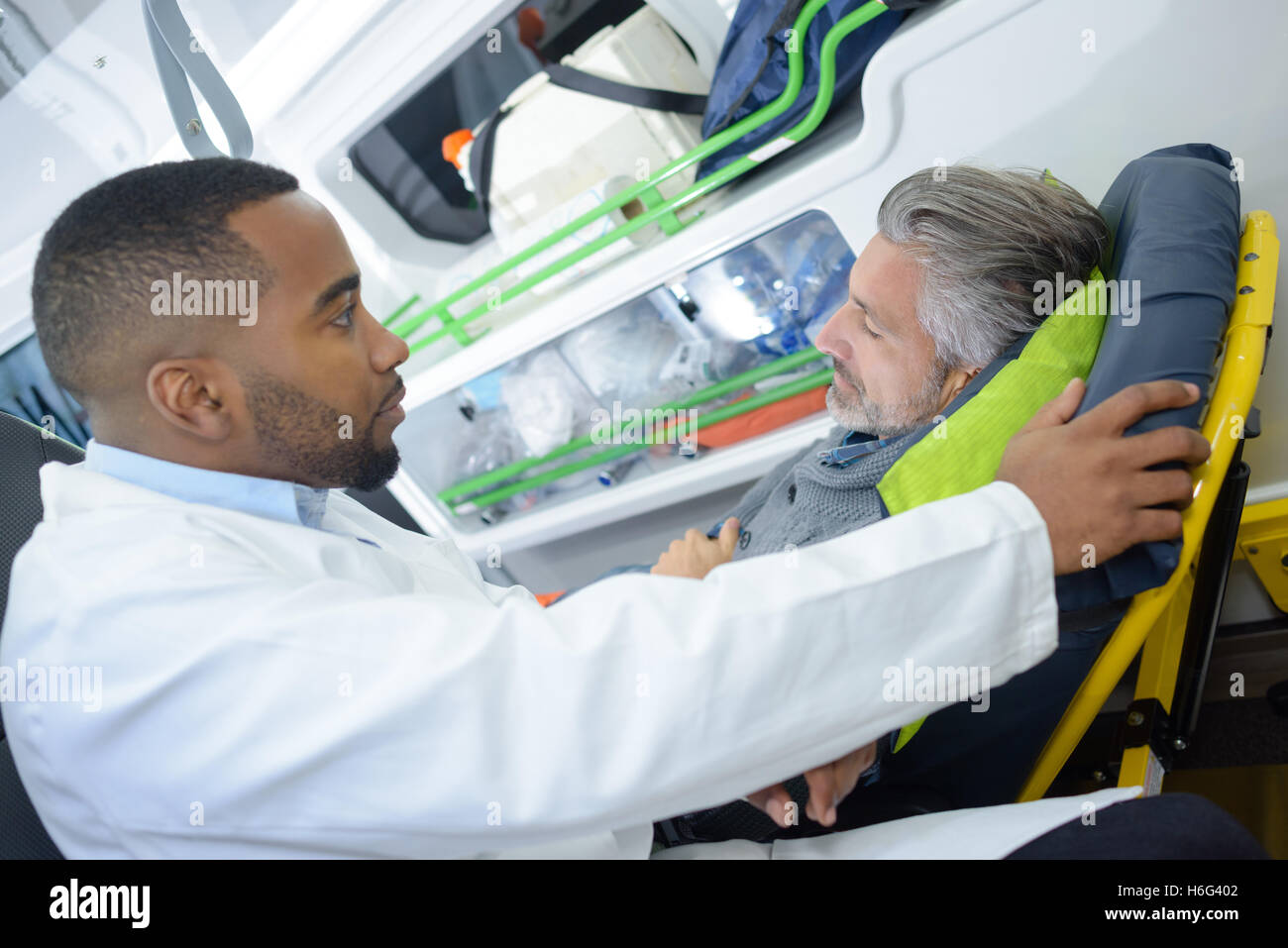 paramedics talking to the patient Stock Photo - Alamy