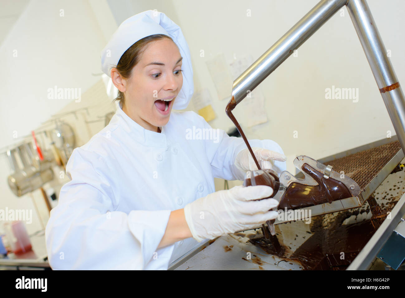 Chef working with melted chocolate, excited expression Stock Photo - Alamy