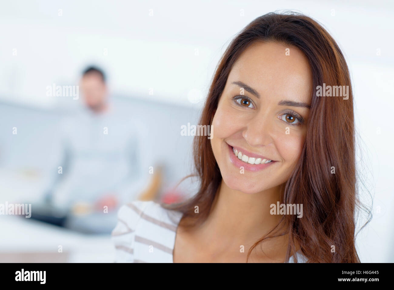 Wife letting her husband cook Stock Photo - Alamy