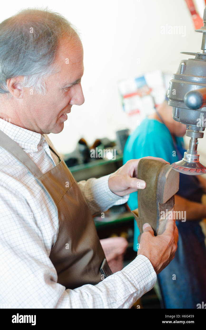 Shoemaker at work Stock Photo - Alamy