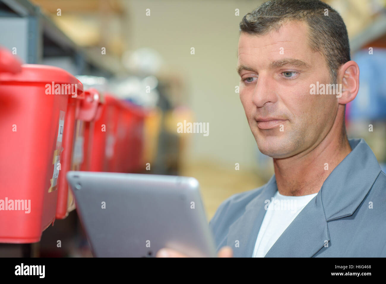 man looking at the tablet Stock Photo - Alamy
