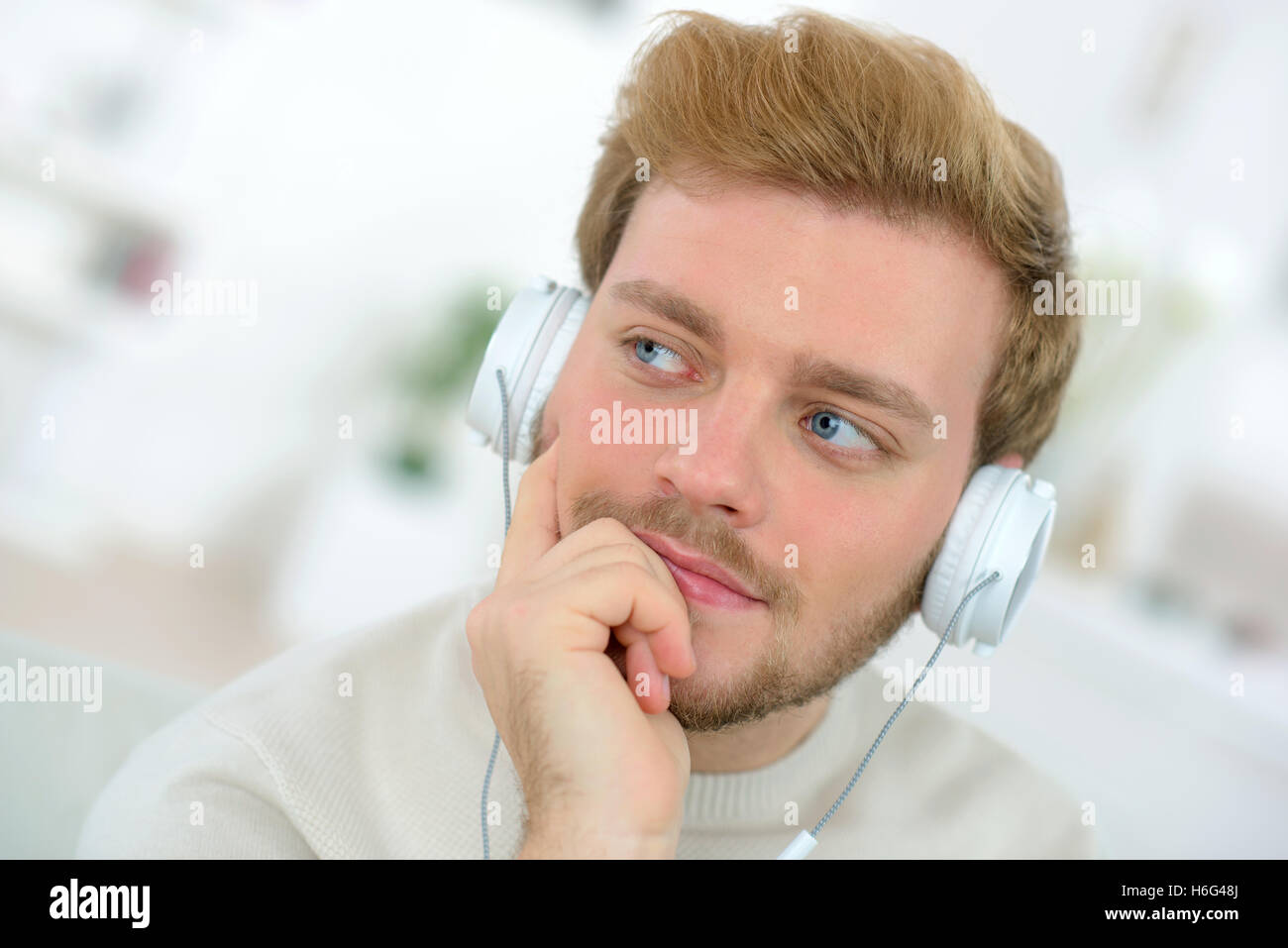 Man listening to music Stock Photo - Alamy