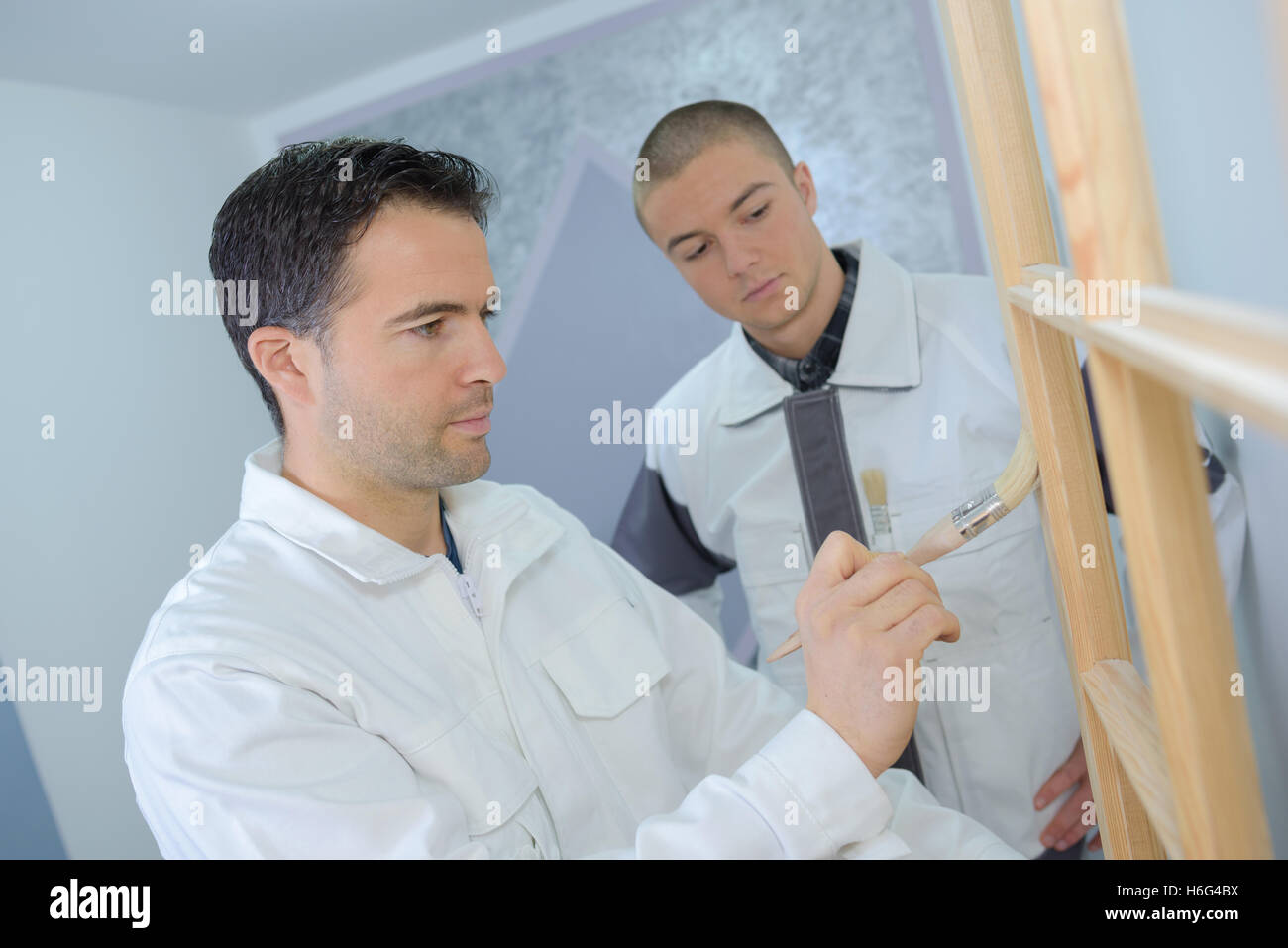 Decorator painting wood Stock Photo - Alamy