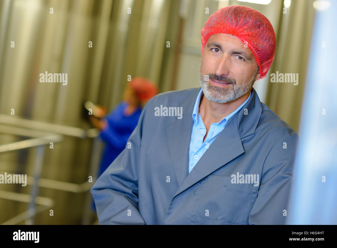 worker leaning and posing Stock Photo - Alamy