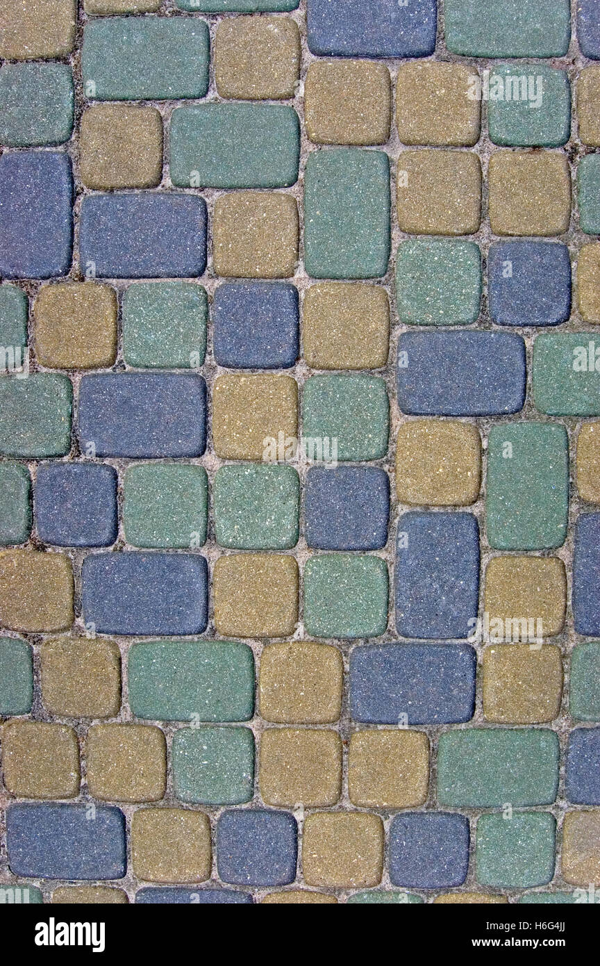 Cobblestone texture background closeup, green, yellow, blue, tan, grey ...