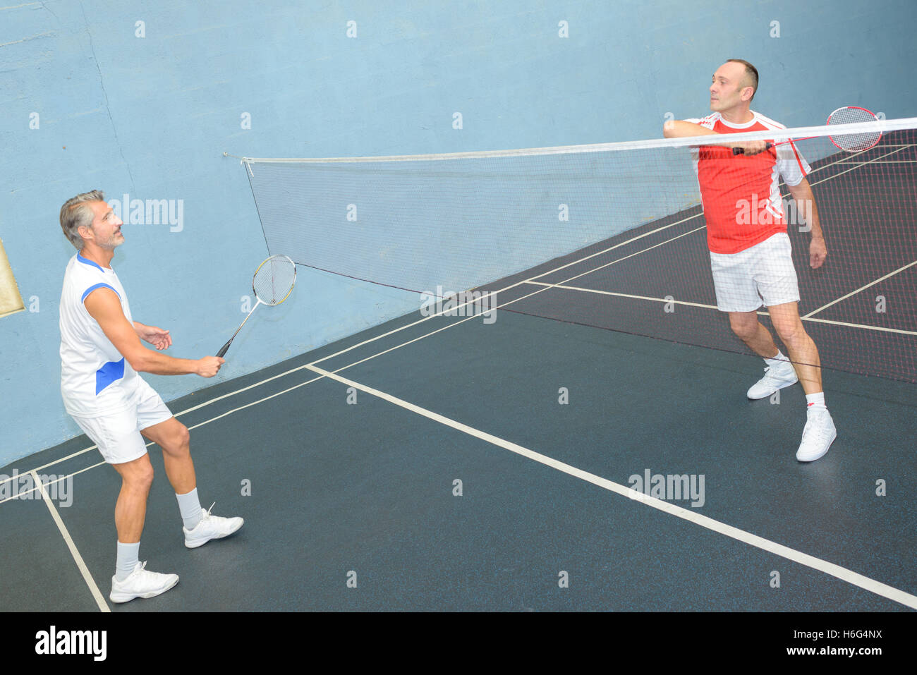 Men playing badminton Stock Photo - Alamy