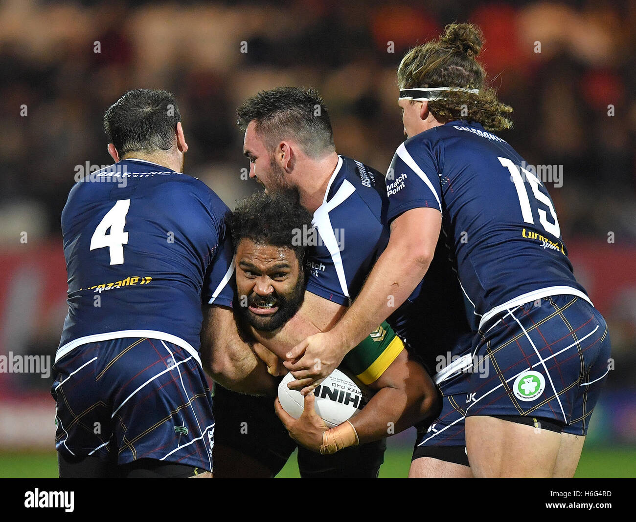 Australia's Sam Thaiday is tackled by Scotland's Luke Douglas, Kane ...