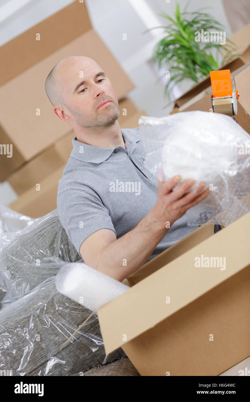 man drops cardboard boxes Stock Photo - Alamy