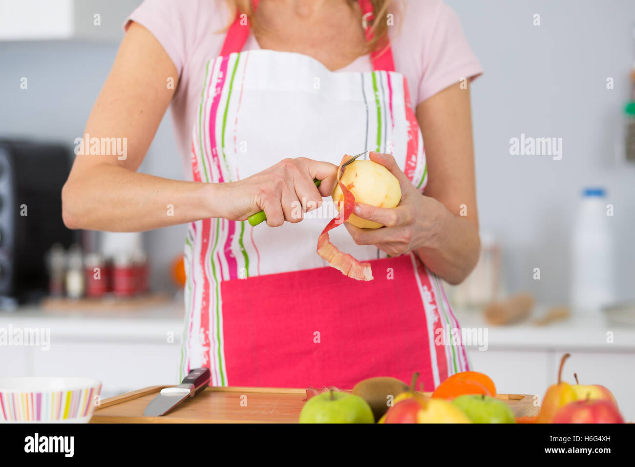 housewife cutting apple Stock Photo - Alamy