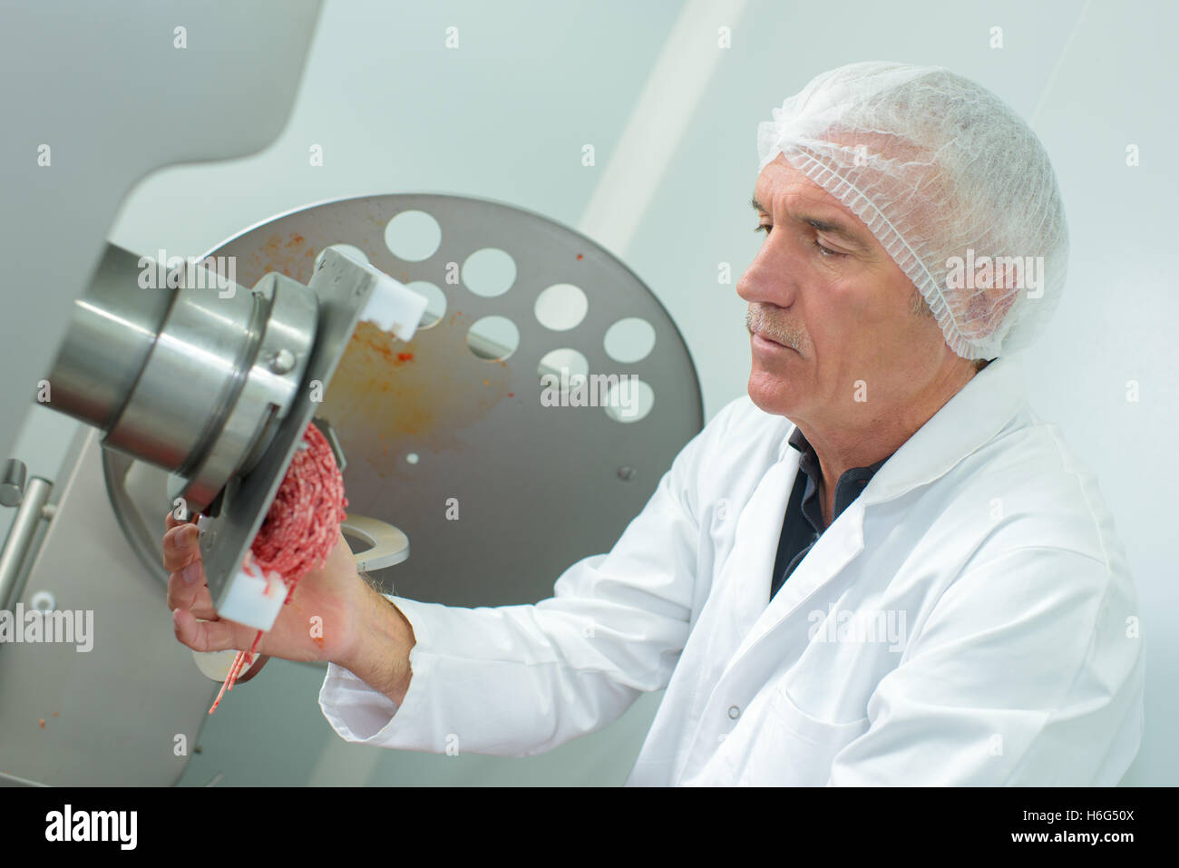 ground meat machine Stock Photo - Alamy
