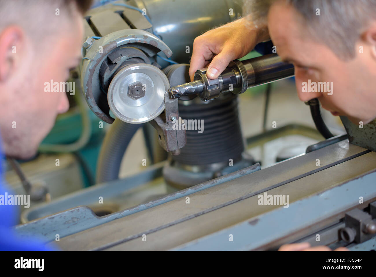 Men fixing machine hi-res stock photography and images - Alamy