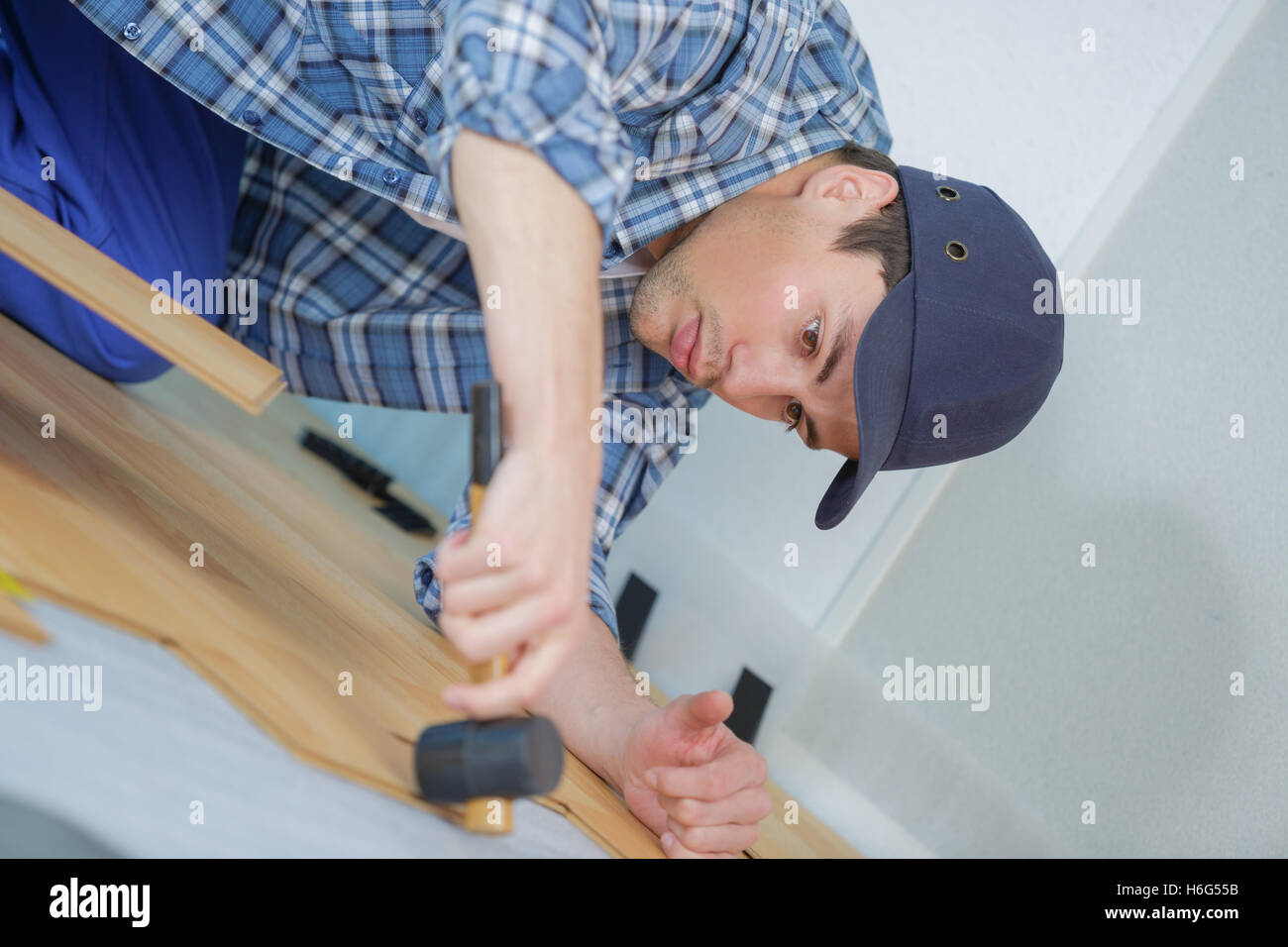 young handyman in uniform Stock Photo - Alamy