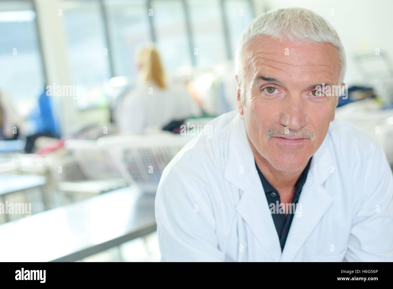 laundry manager posing Stock Photo - Alamy