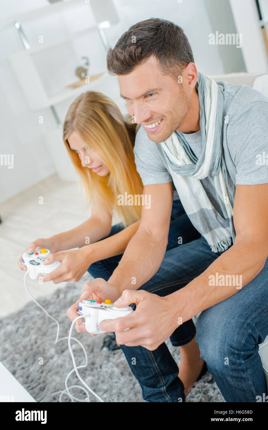 Couple playing computer game Stock Photo - Alamy