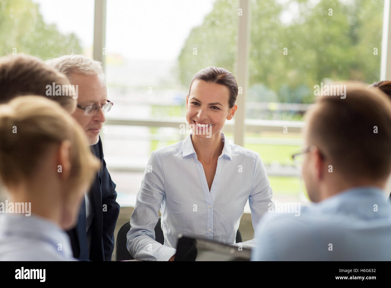 smiling business people meeting in office Stock Photo - Alamy