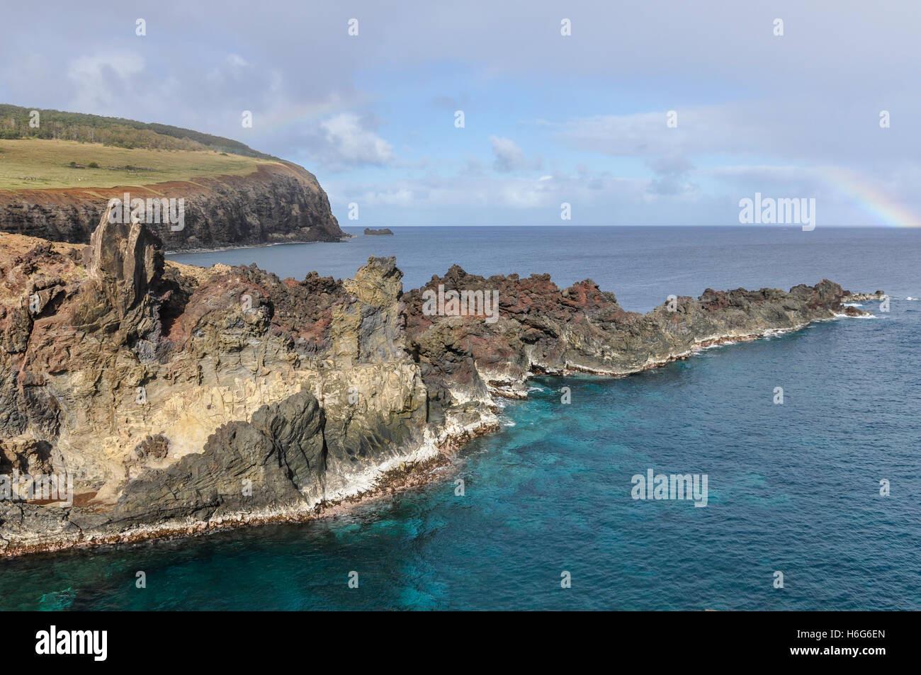 Coastal Scenery with rainbow on the most remote habited Easter Island ...