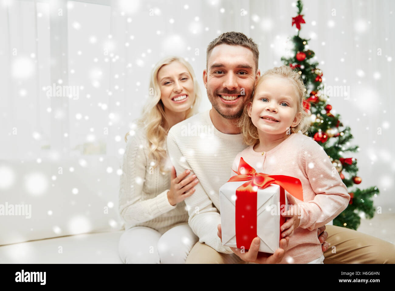 happy family at home with christmas gift box Stock Photo - Alamy