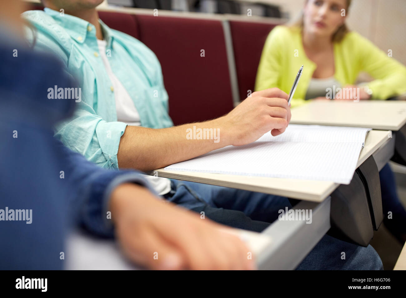 group of students with notebooks at lecture hall Stock Photo - Alamy