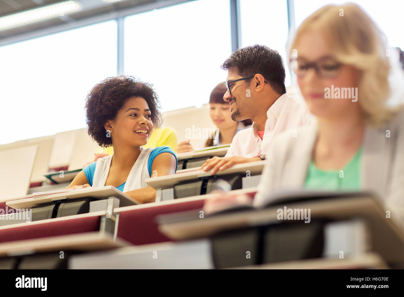 international students talking in lecture hall Stock Photo - Alamy