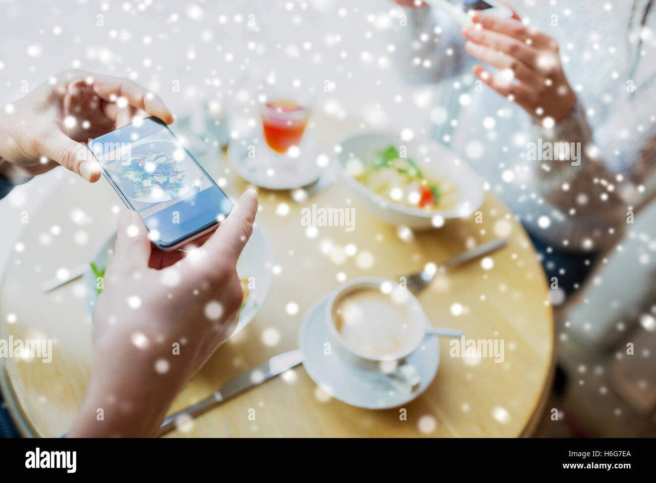 close up of couple picturing food by smartphone Stock Photo - Alamy